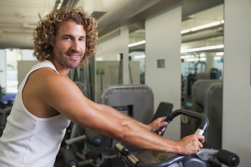 Side View Portrait of Man Working Out on Exercise Bike Stock Image ...