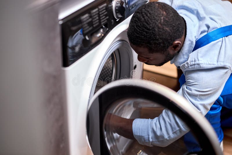 Side View Portrait of Professional Afro Technician Examining Broken ...