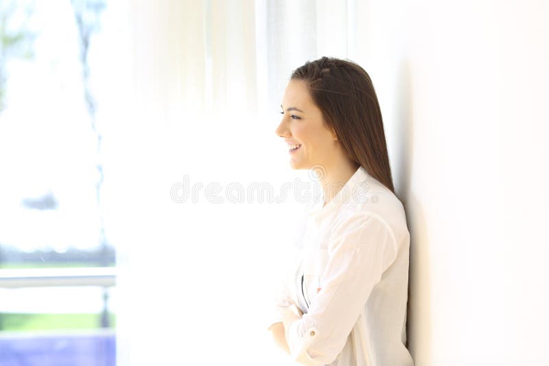 Proud Woman Looking through a Window Stock Photo - Image of folded ...