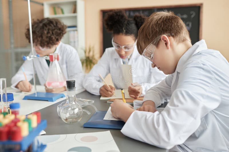 Side View Schoolboy in Science Class with Group of Children Stock Photo ...
