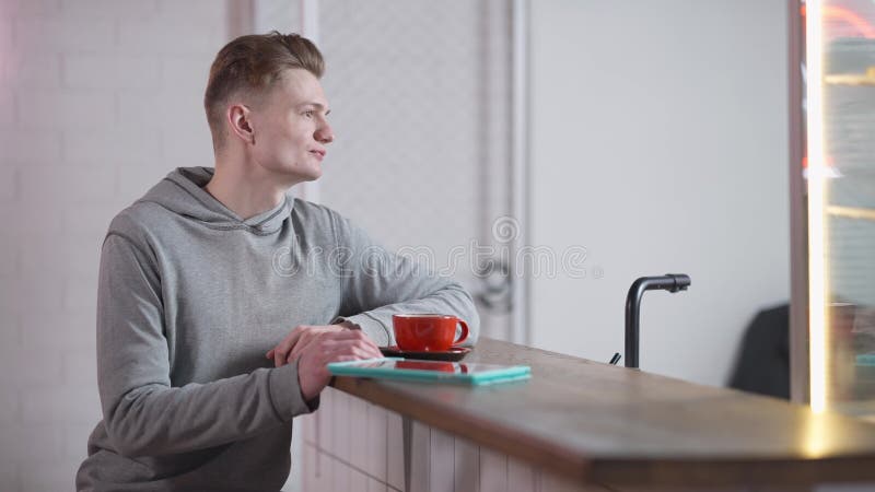 Side View of Positive Confident Millennial Student Sitting at Cafe ...