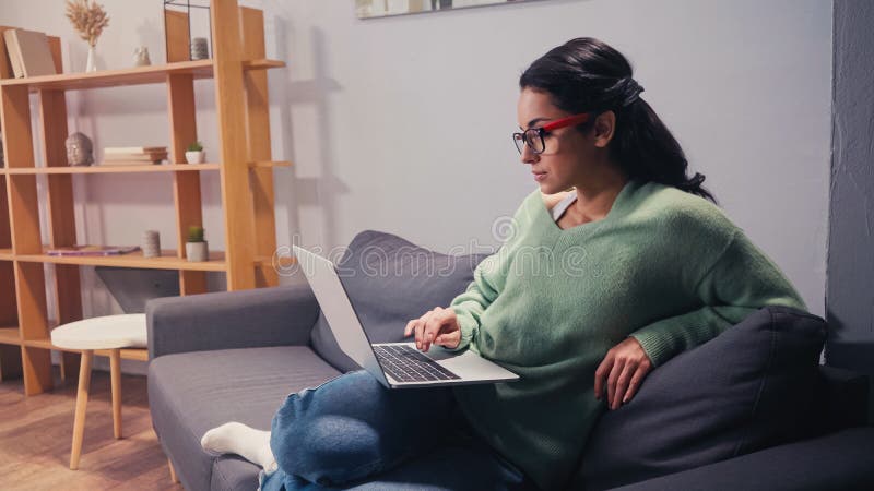 Side View of Pretty Teleworker Using Stock Photo - Image of couch ...