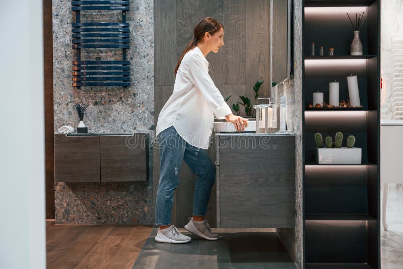 Side View. Pretty Young Woman is in the Store of Goods for the Home ...