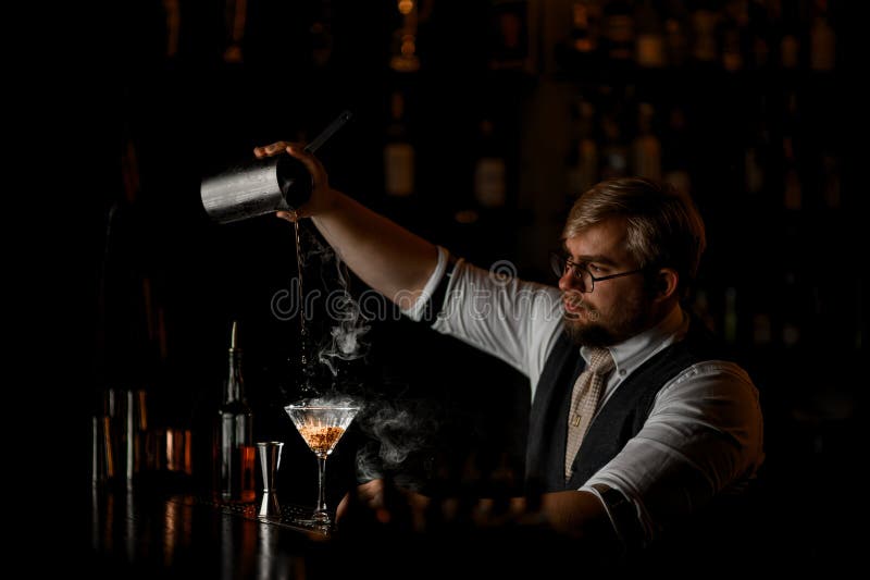 Side View of the Process of Making a Cocktail As the Bartender Pours ...
