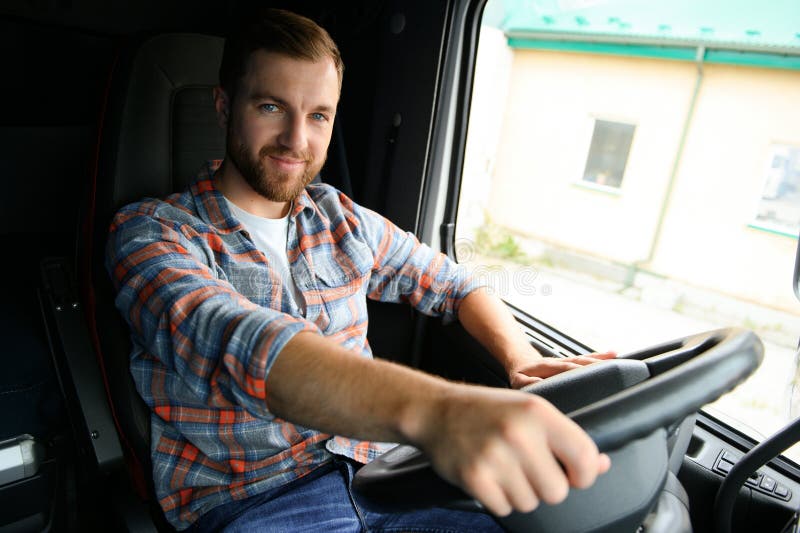 Side View of Professional Driver Behind the Wheel in Truck& X27;s Cabin ...