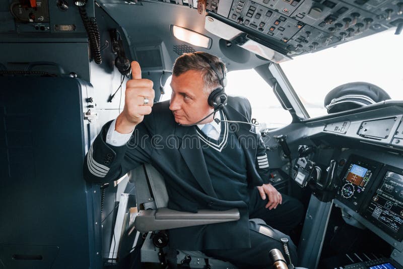Side View. a Professional Pilot is in the Cockpit Stock Photo - Image ...
