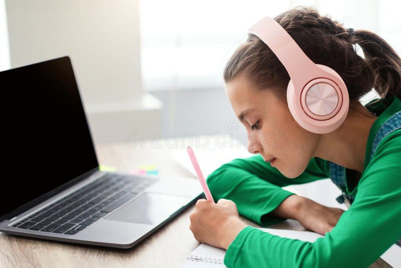 Girl Headset Writing Notes Using Laptop Empty Screen Stock Photos ...