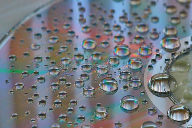 Side View of Rainbow Water Drops in Macro View of Metallic Surface ...