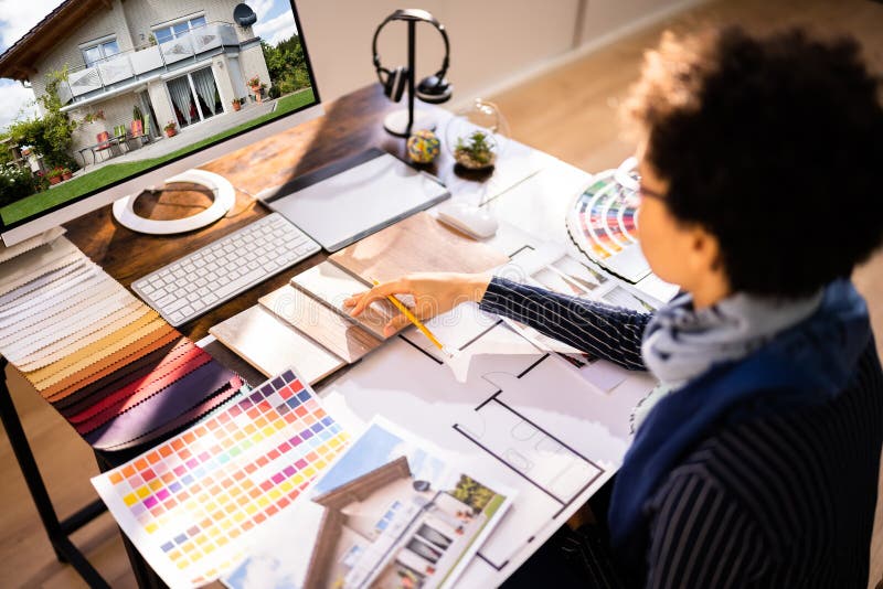 Side View of Real Estate Designer Working on Computer Stock Image ...