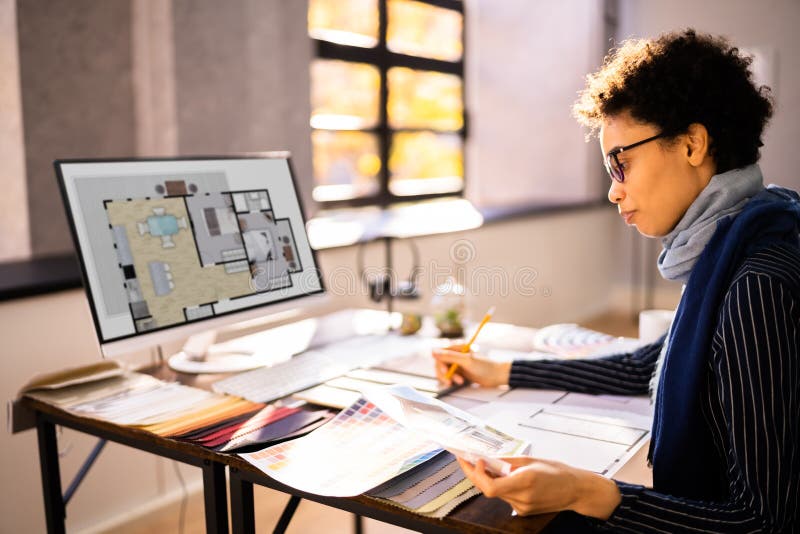 Side View of Real Estate Designer Working on Computer Stock Image ...