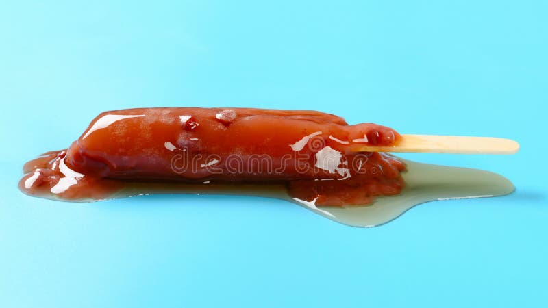 Side View Red Bean Popsicles Melting on Blue Background Timelapse Stock ...