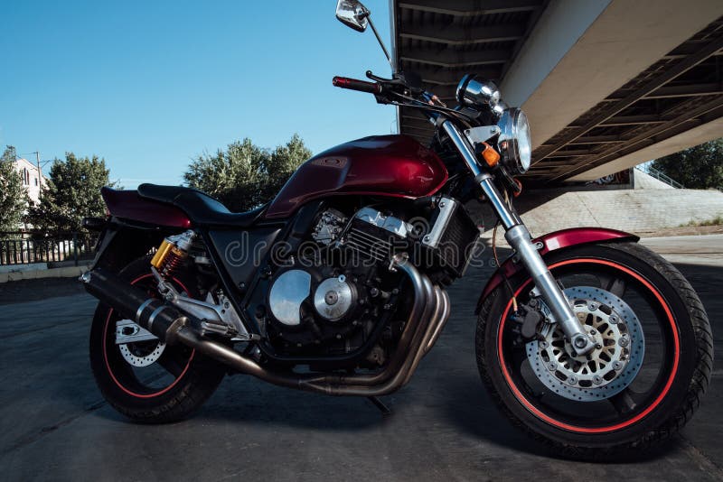 Side View of a Red Motorcycle Stock Image - Image of dark, road: 196316785