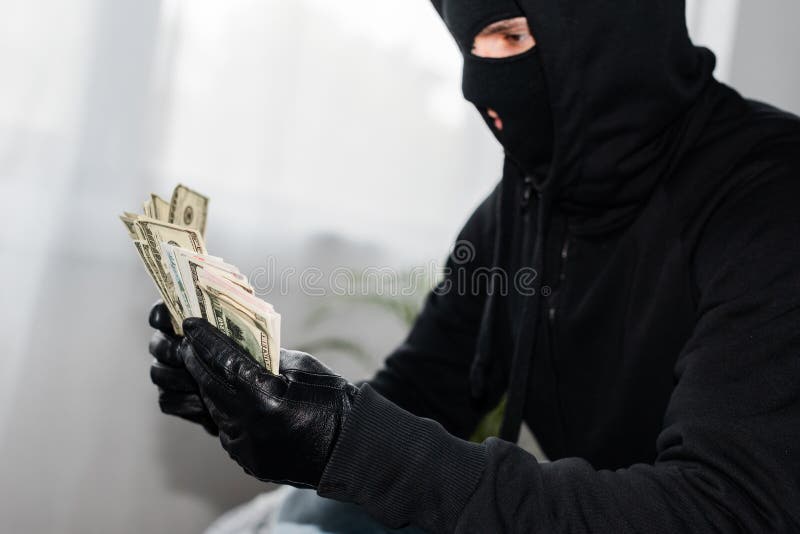 View of Robber in Balaclava Holding Stock Image - Image of dollars ...
