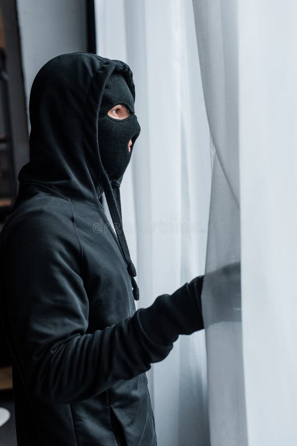 View of Robber in Balaclava Standing Stock Photo - Image of leather ...