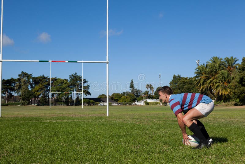 Side View of Rugby Player Crouching on Field Stock Photo - Image of ...