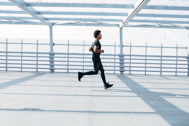 Side view of a runner stock image. Image of athlete - 137518667