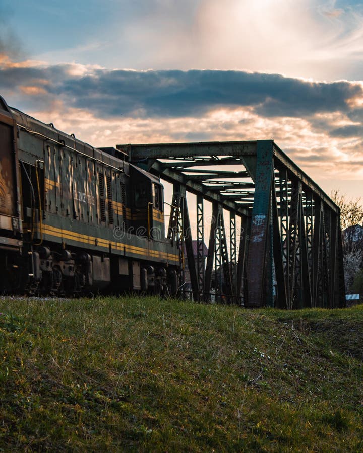 Side View of an Rustic Aged Train on Railway Tracks at Sunset Stock ...