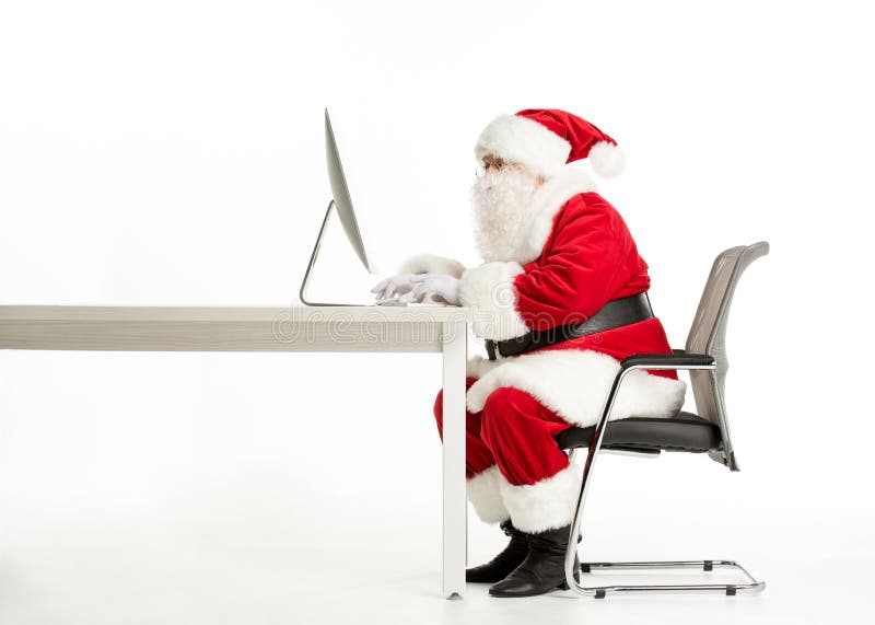 Santa Claus using computer stock photo. Image of christmastime - 123119768