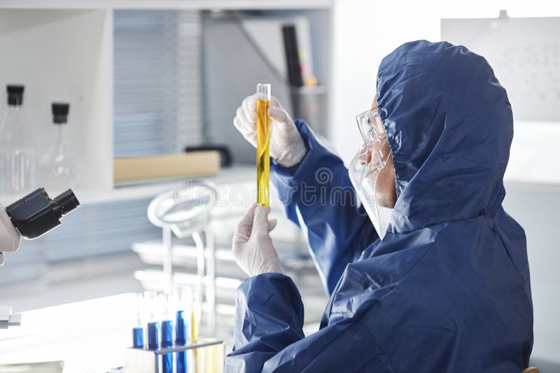 Side View of Scientist Wearing Protective Suit in Laboratory Doing ...