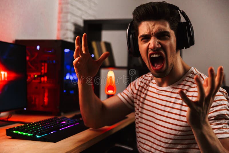 Side View of Screaming Gamer Playing Video Games on Computer Stock ...