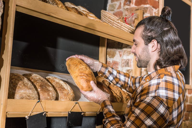 Side View of Seller Taking Freshly Baked Bread Stock Image - Image of ...
