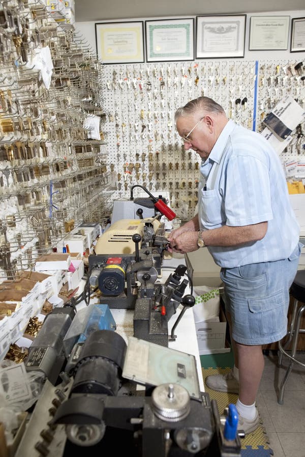Side View of Senior Locksmith Working in Store Stock Image - Image of ...