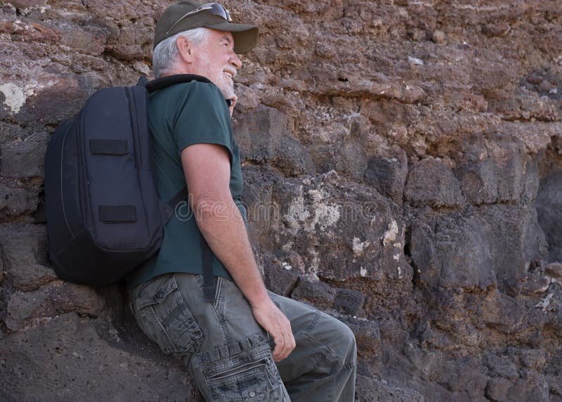 Side View of a Senior Man with Backpack Walking in Outdoor Excursion ...