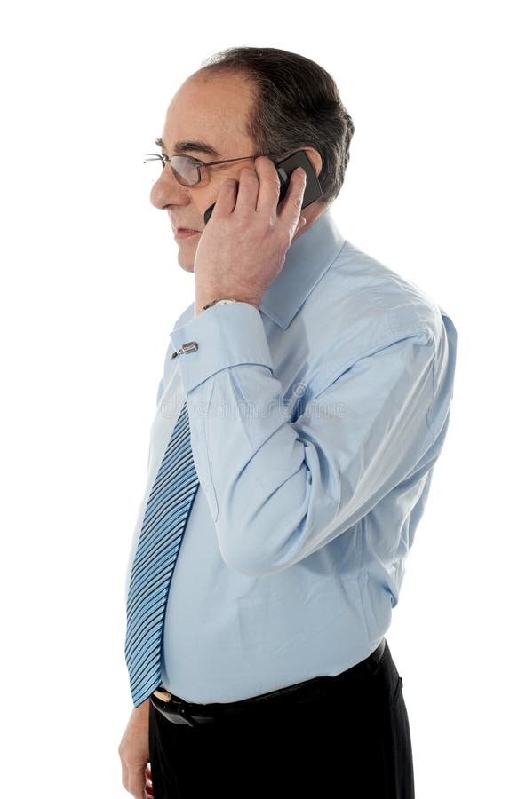 Side View of a Senior Manager Attending Phone Call Stock Image - Image ...