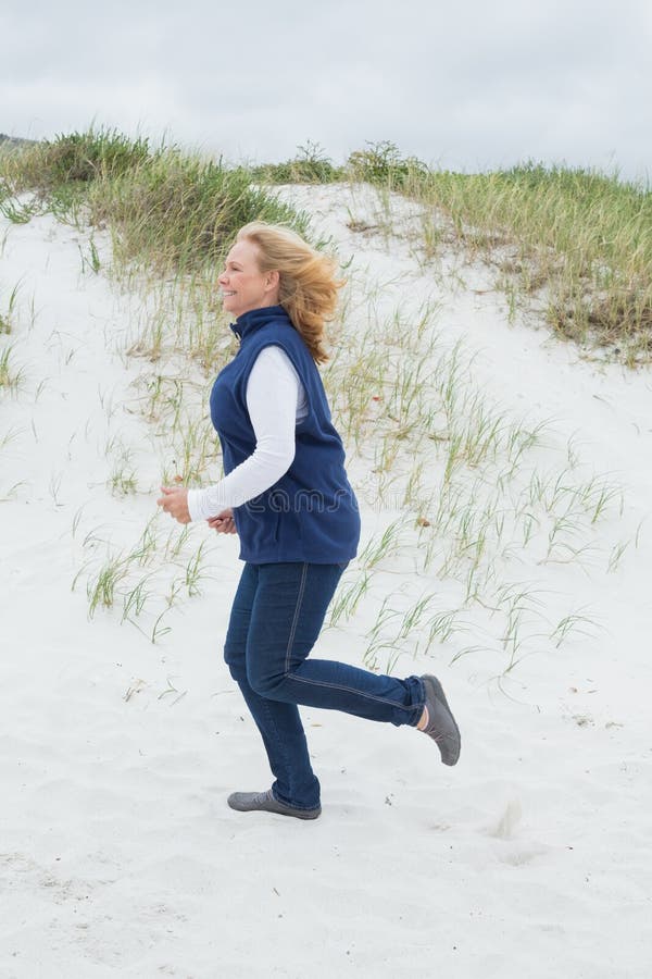 Side View of a Senior Woman Jogging at Beach Stock Photo - Image of ...