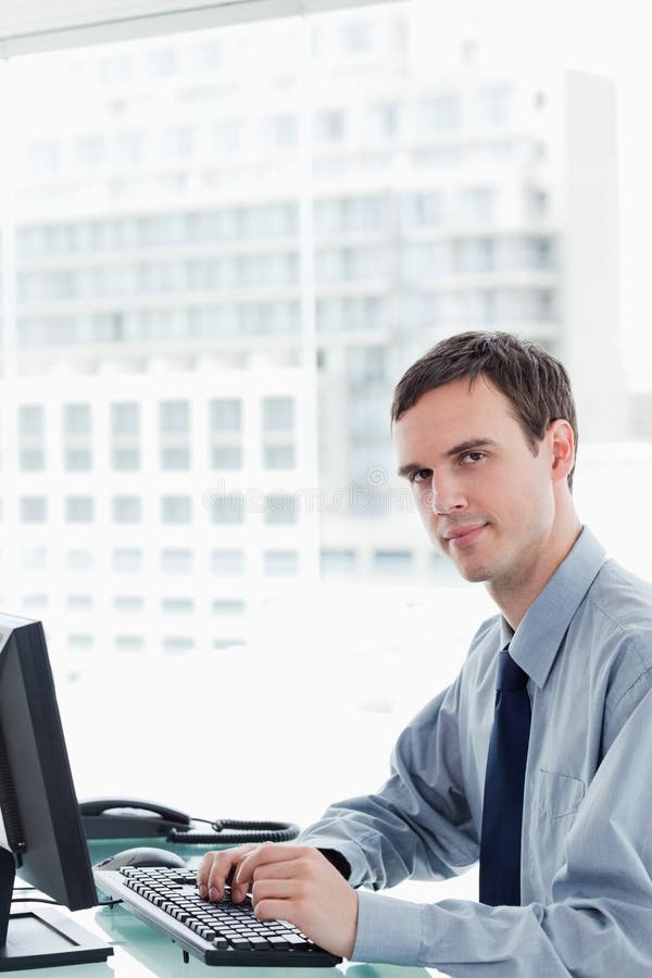 Side View of a Serious Office Worker Using a Monitor Stock Photo ...
