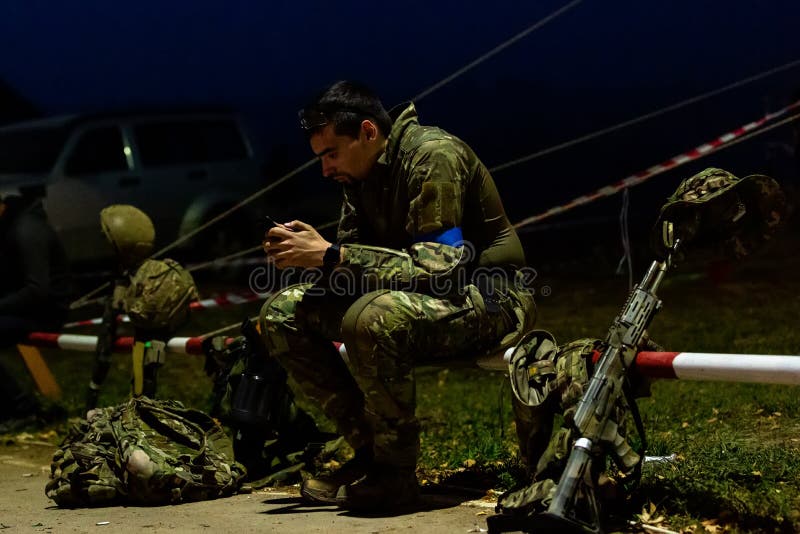 Side View Serious Soldier Writing Message in Phone while Wearing in ...