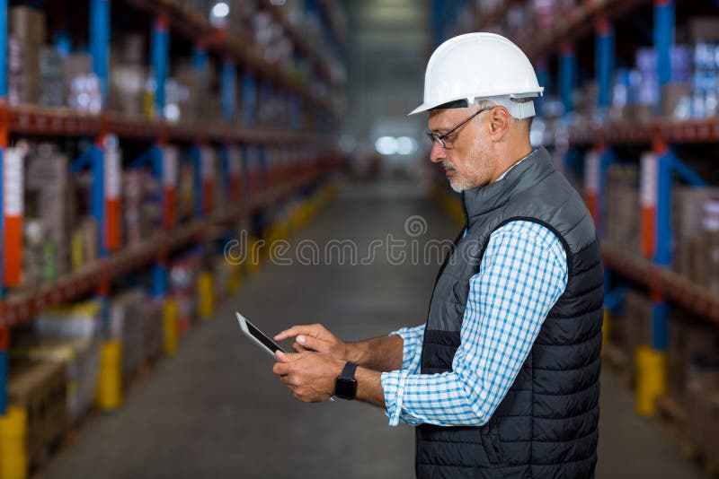 Side View of Serious Worker is Using a Tablet Stock Image - Image of ...
