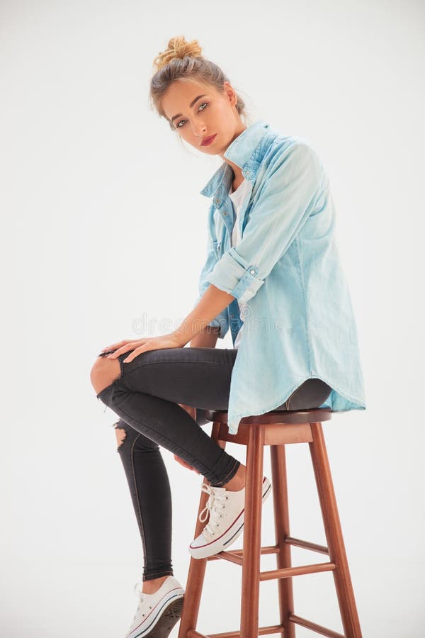 Side View of a Casual Woman Sitting Stock Photo - Image of stool, hair ...