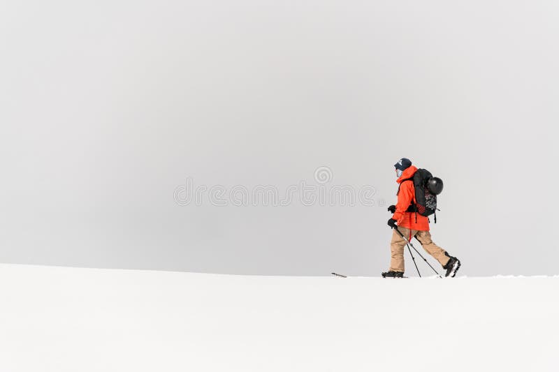Side View of a Skier Walking on a Flat Surface Looking Carefully Ahead ...