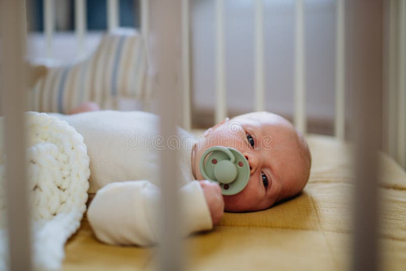 Side View of Sleeping Baby in Little Bed. Stock Photo - Image of ...