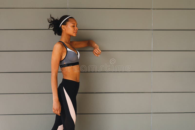 Side View of a Slim Female Athlete Taking a Break Stock Image - Image ...
