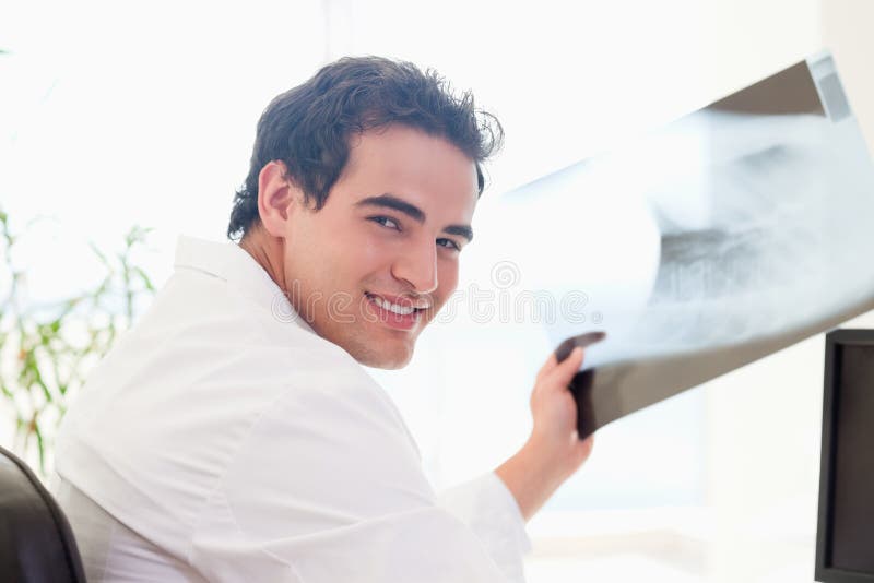 Side View of Smiling Doctor with X-ray Stock Photo - Image of ...