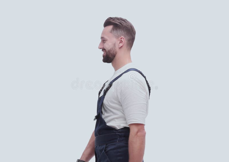 Side View. Smiling Man in Overalls Confidently Striding Forward Stock ...