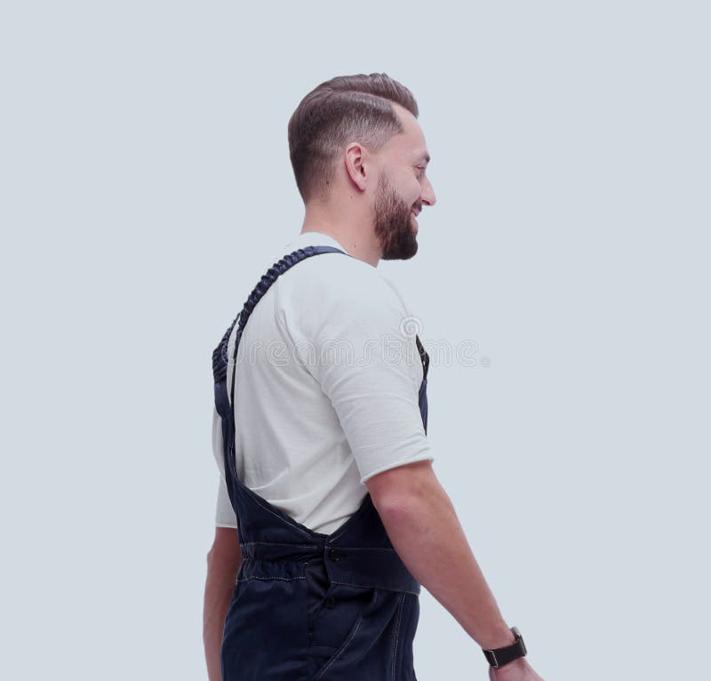 Side View. Smiling Man in Overalls Confidently Striding Forward Stock ...
