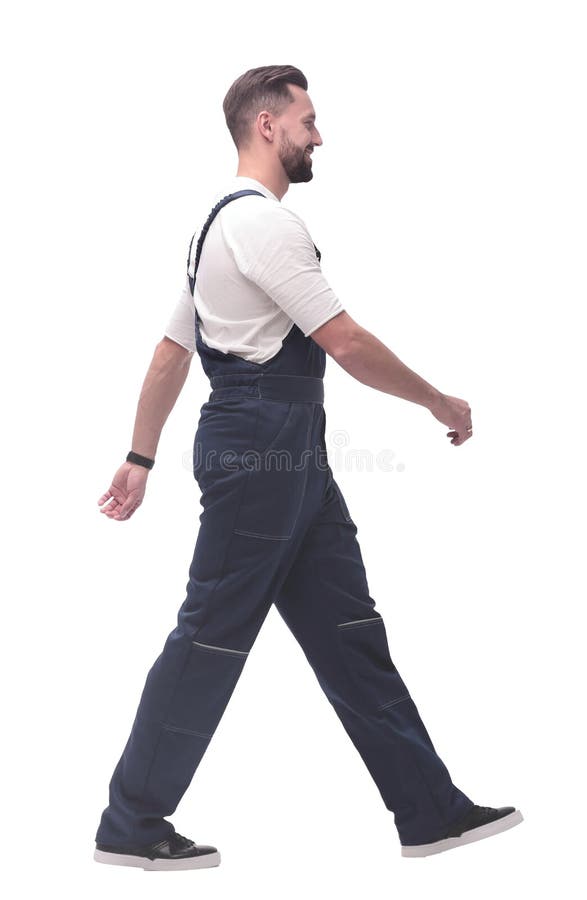 Side View. Smiling Man in Overalls Confidently Striding Forward Stock ...
