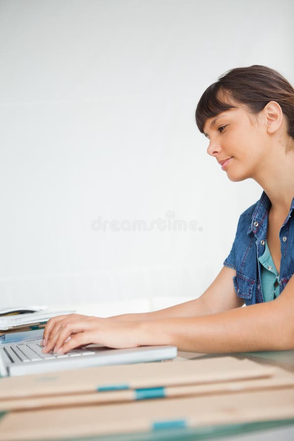 Side View of a Smiling Student Doing Her Homework Stock Image - Image ...