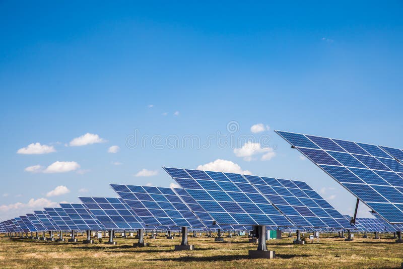 Side View of Solar Panels on Blue Sky with Clouds Stock Photo - Image ...