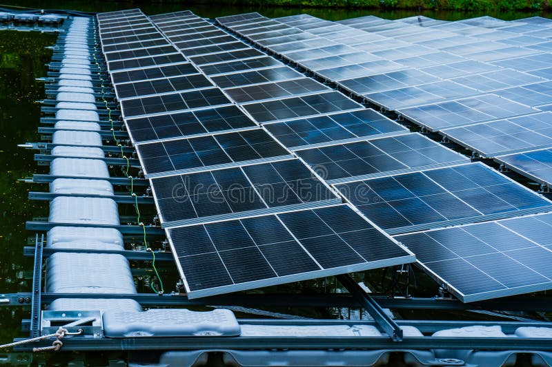 Side View of Solar Panels Floating on Water in a Lake, for Generating ...