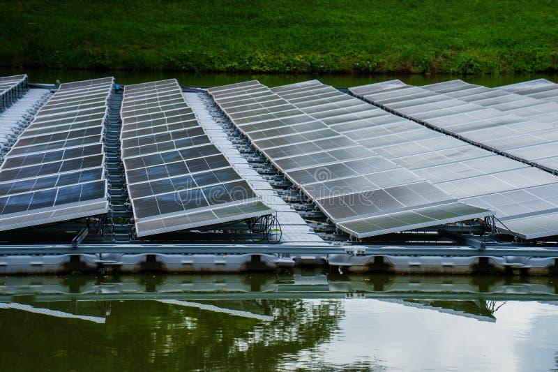 Side View of Solar Panels Floating on Water in a Lake, for Generating ...