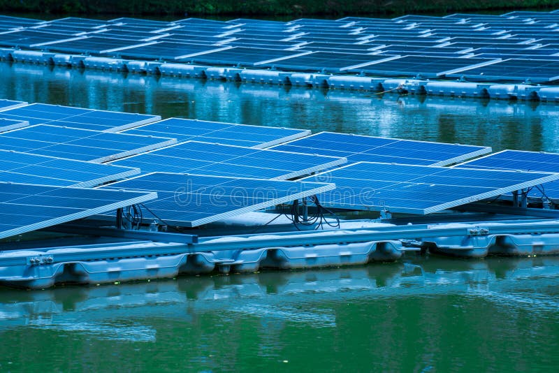 Side View of Solar Panels Floating on Water in a Lake, for Generating ...
