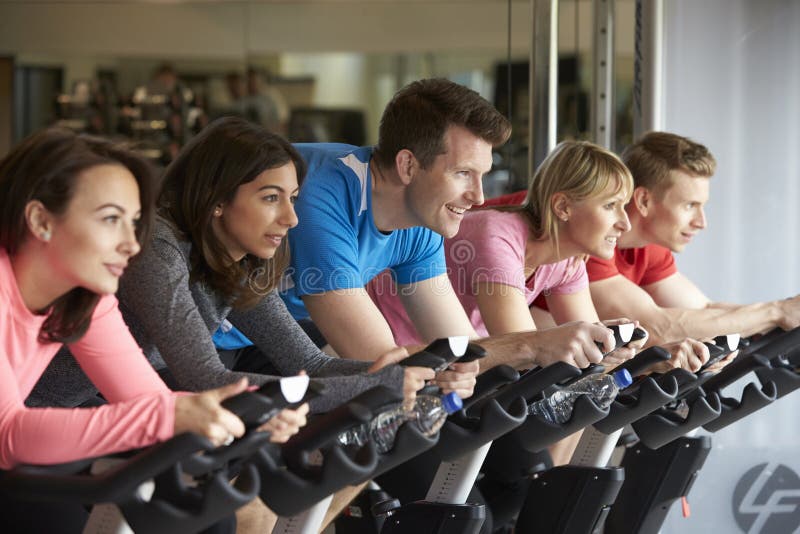 Side View of a Spinning Class on Exercise Bikes at a Gym Stock Image ...