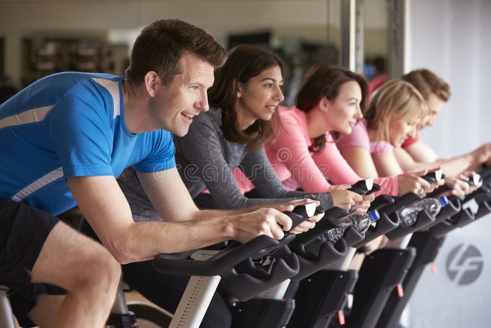 Side View of a Spinning Class on Exercise Bikes at a Gym Stock Image ...