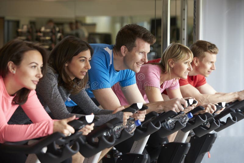 Side View of a Spinning Class on Exercise Bikes at a Gym Stock Image ...