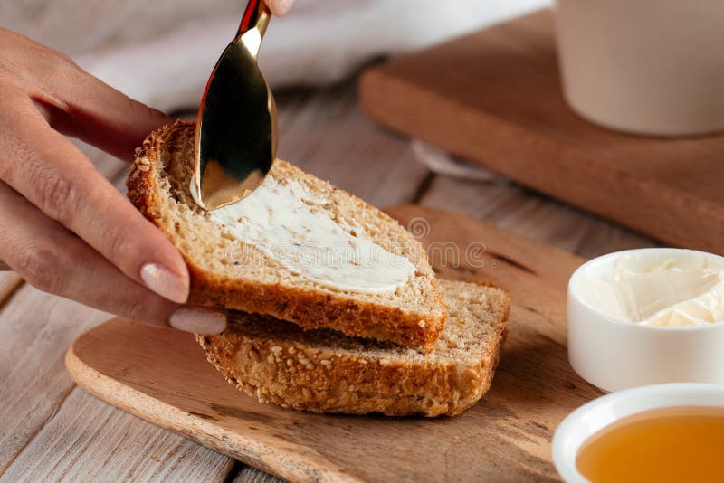 Side View on Spreading Bread Slice with Butter Stock Image - Image of ...