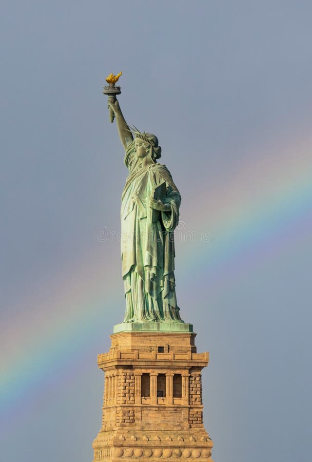 Side View of the Statue of Liberty and a Rainbow in the Background ...